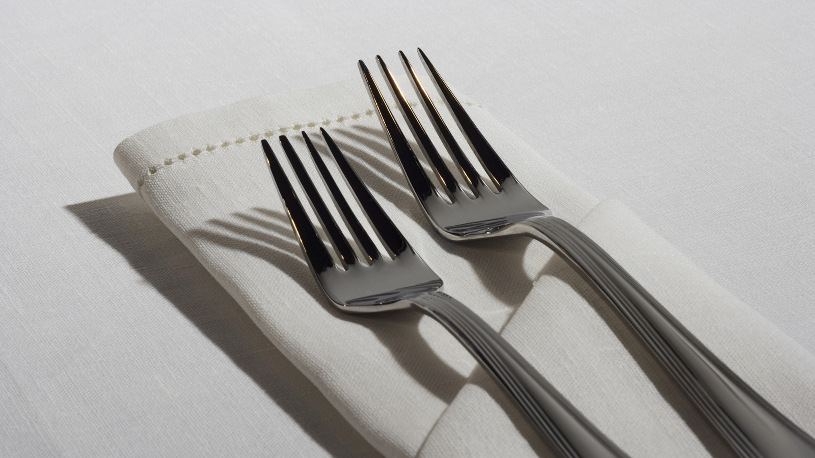 The Rule To Know When Navigating All Those Forks At A Table Setting