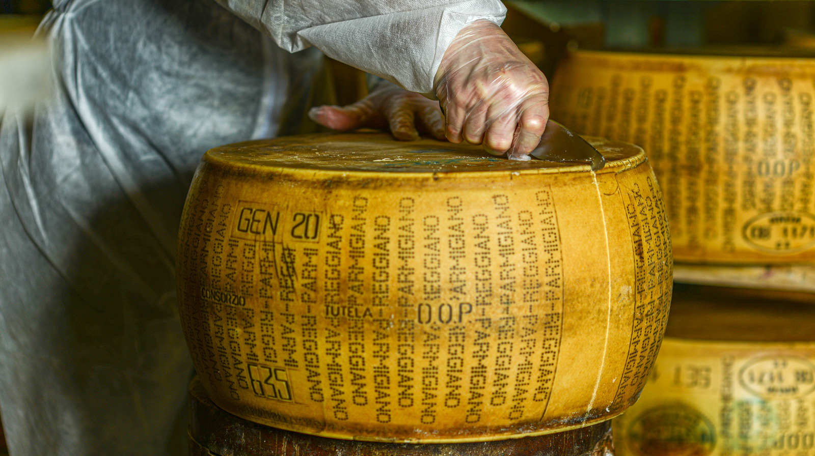 The Grocery Stores That Crack A Fresh Wheel Of Parmigiano Reggiano