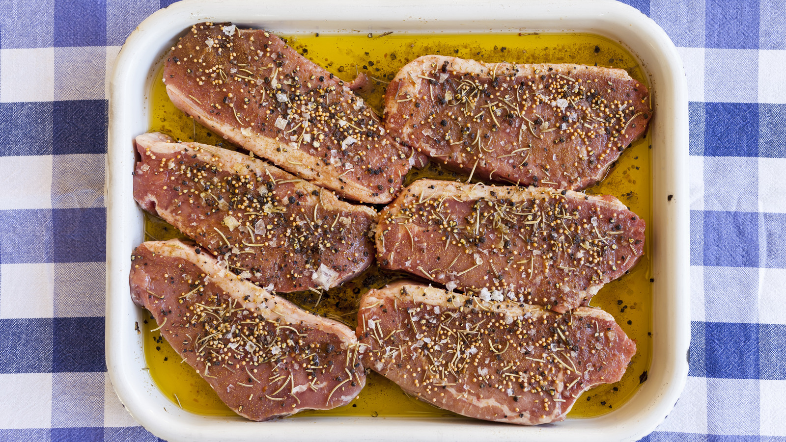 Why You Should Avoid Marinating Meat In A Metal Container